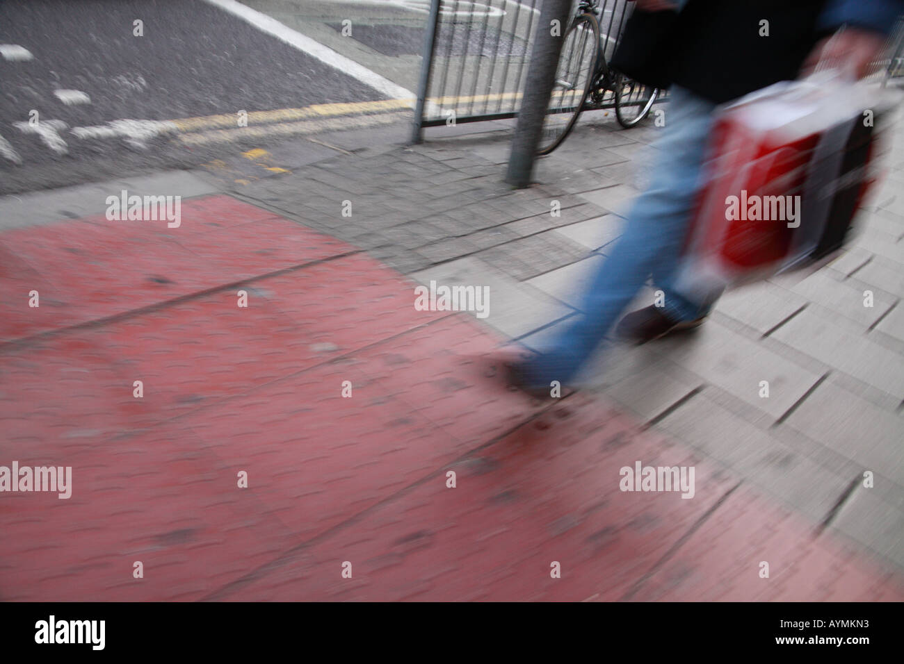 Pedestrian shopper shopping pavement path crossing bag walk road denim ...