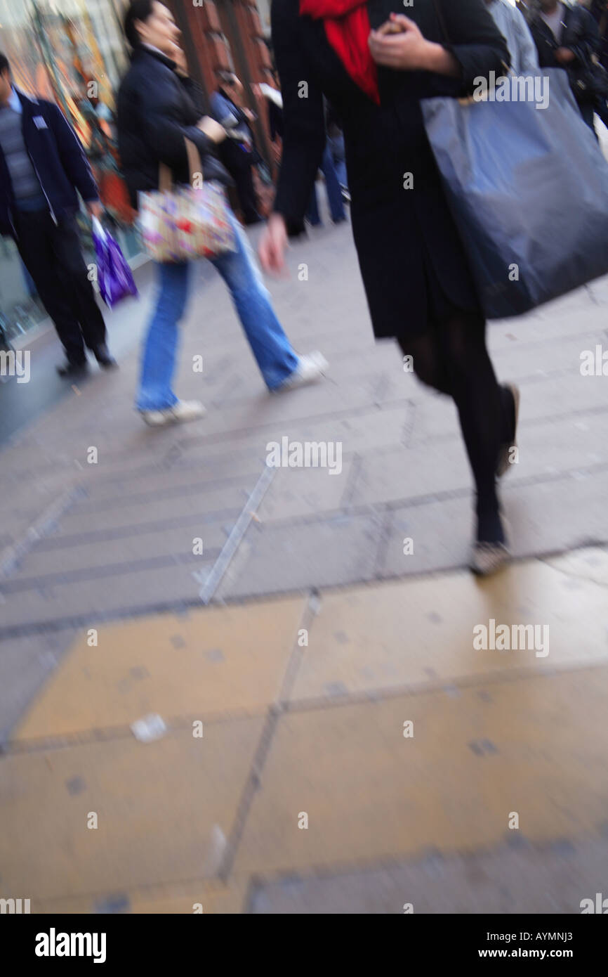 Shopper pedestrian shopping walking bags fashion path pavement Stock ...