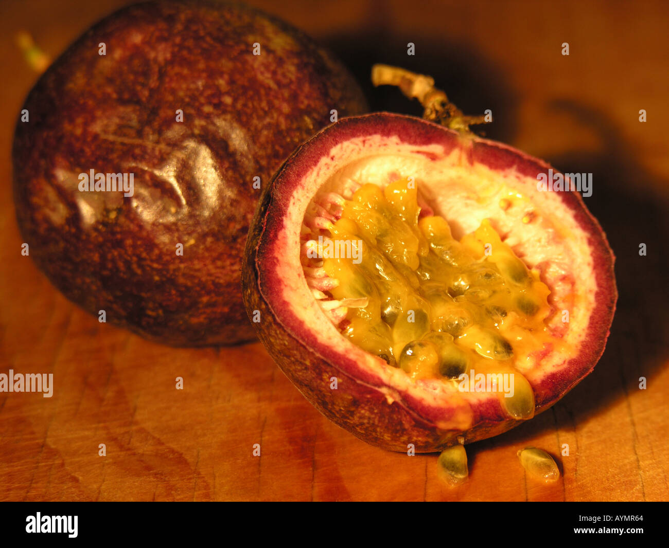 Passion fruit cut open Stock Photo - Alamy