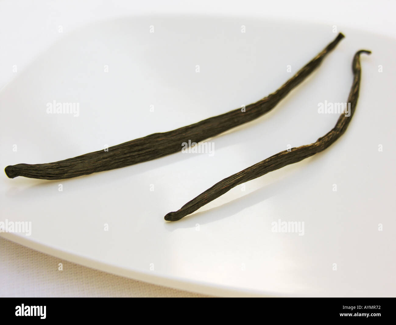 Dried vanilla pods on white plate Stock Photo - Alamy