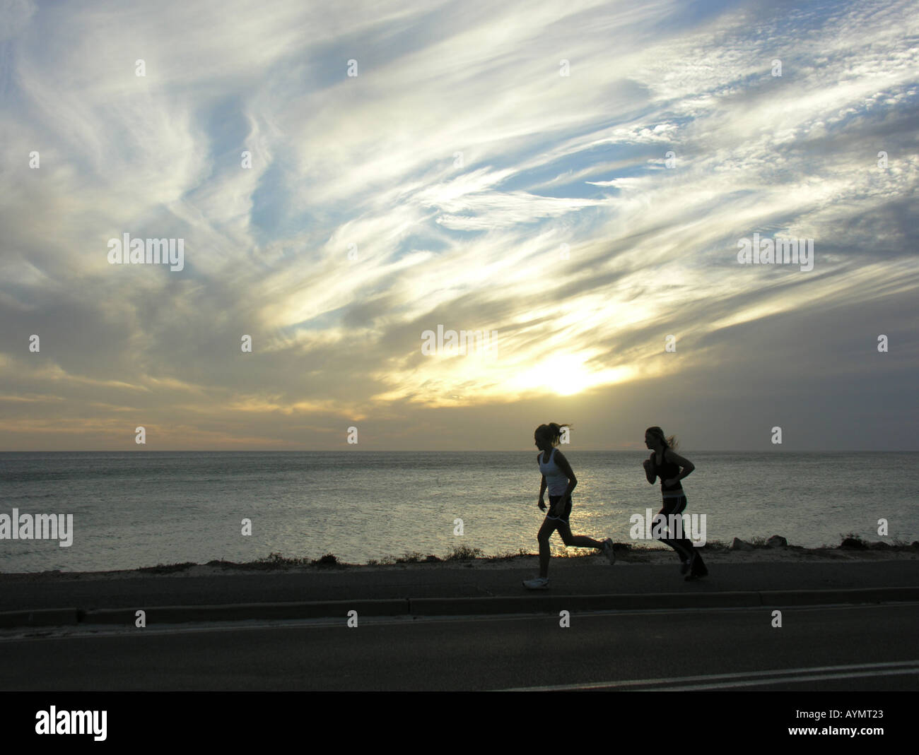 Women running in water hi-res stock photography and images - Alamy