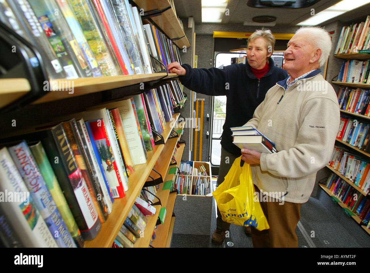 A pensioner visiting a mobile library in Devon UK Stock Photo - Alamy