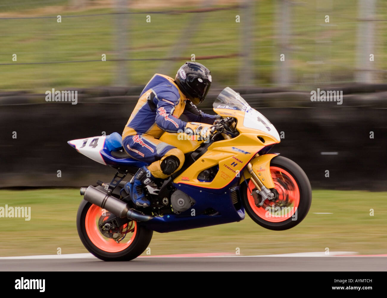Carl Rennie Riding a Suzuki Powerbike Pulling a Wheelie in Race at ...