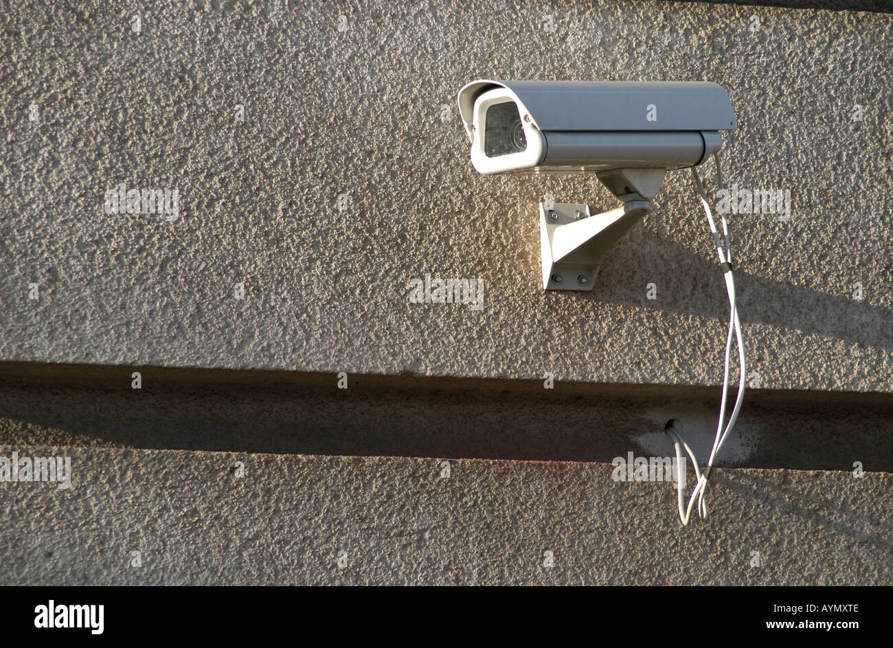 Security camera on the wall Stock Photo - Alamy