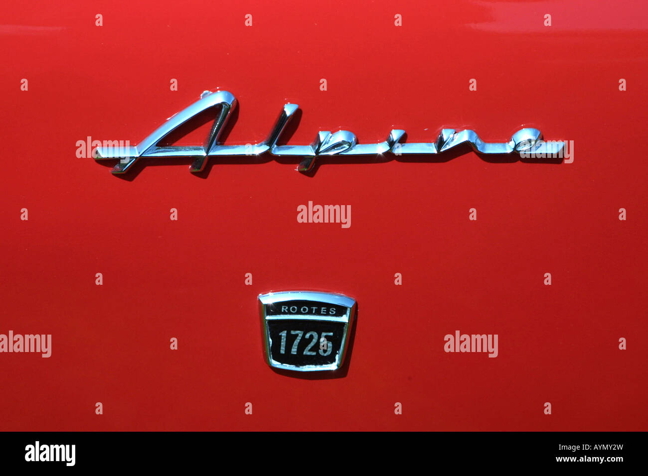 Alpine side badge, horizontal . red paint. Badge and chrome logo Stock ...
