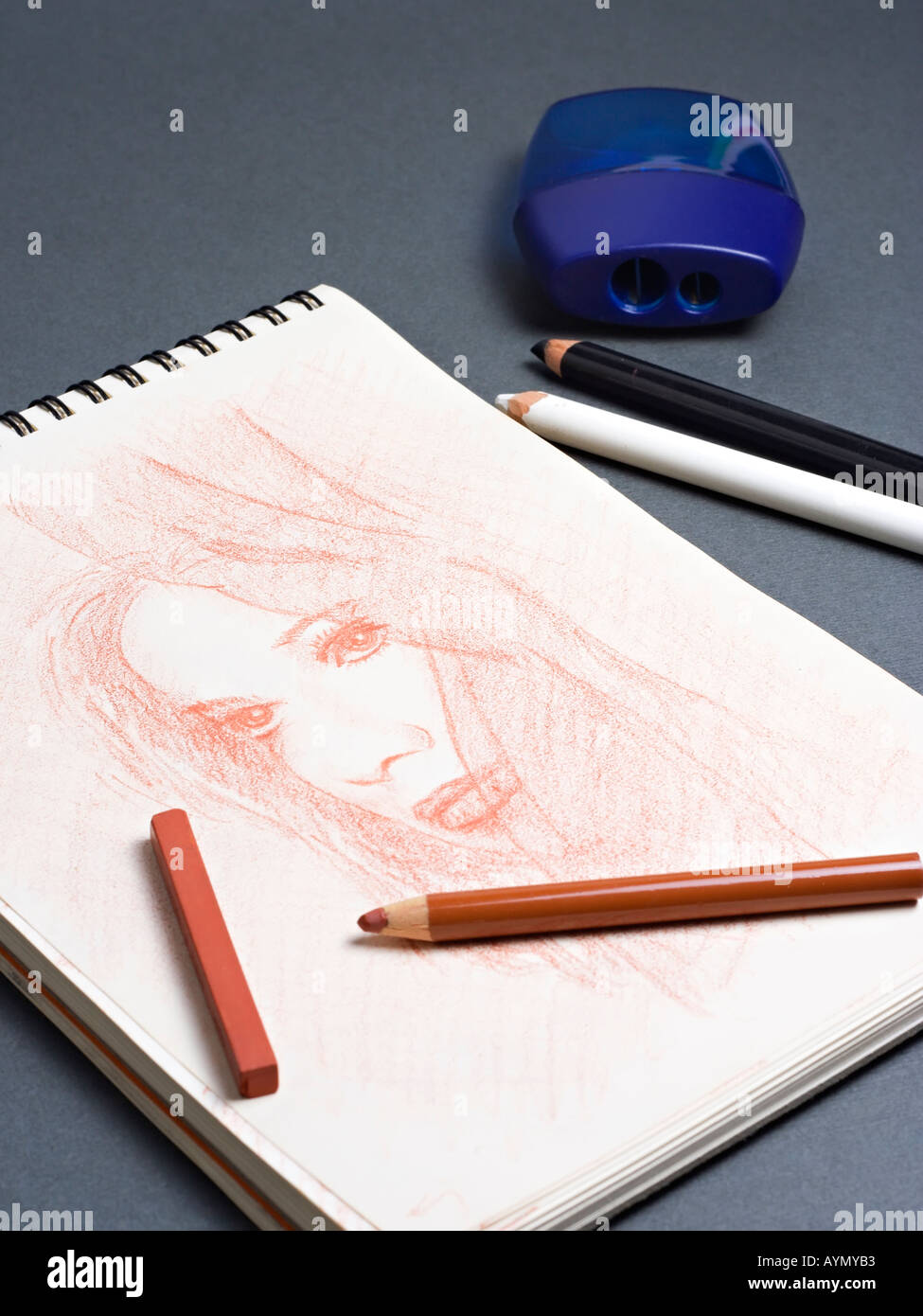 Sketch book showing a portrait drawing of a young woman Stock Photo - Alamy