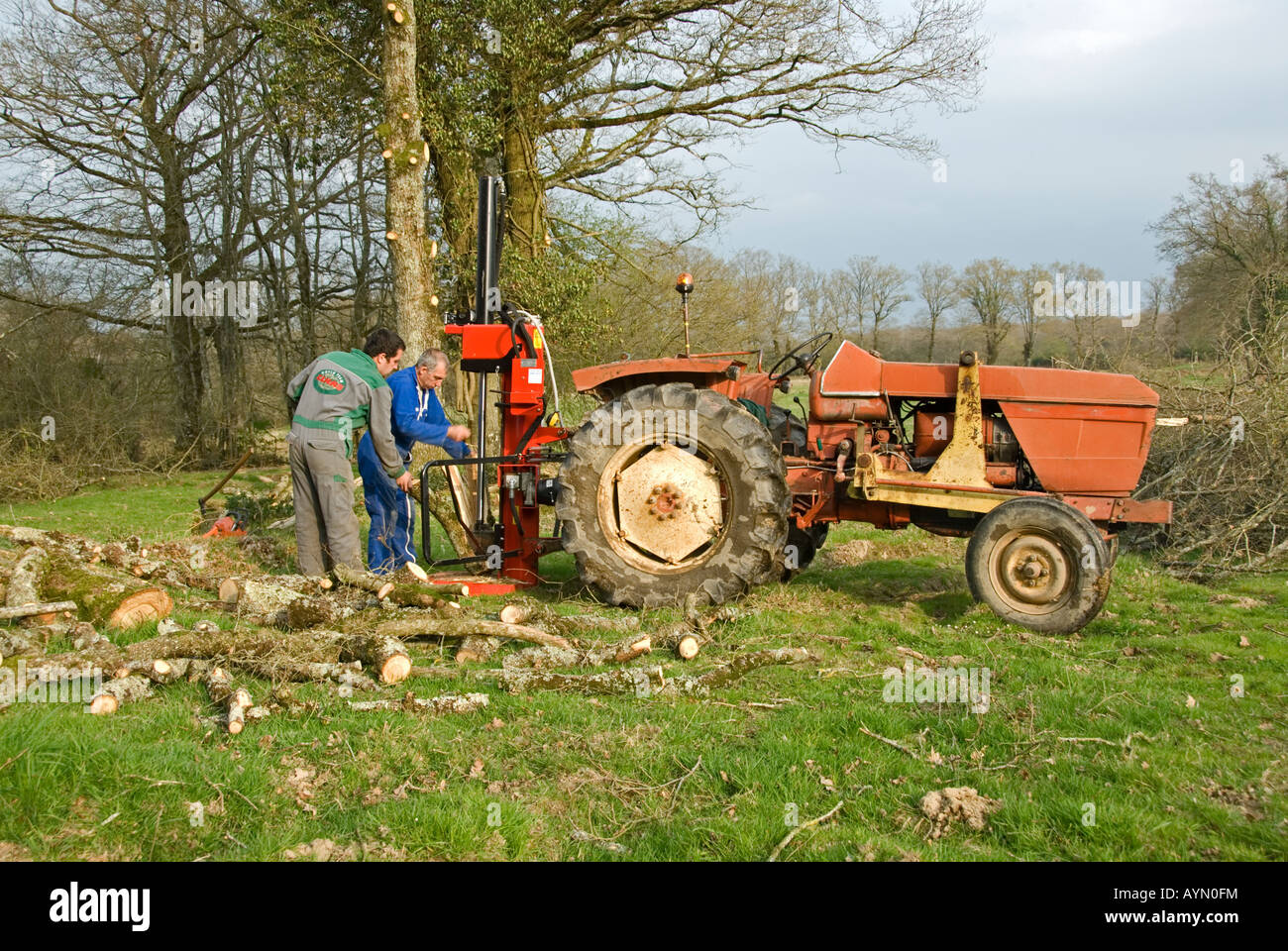Stock photo of a hydraulic log splitting machine attached to a tractor ...