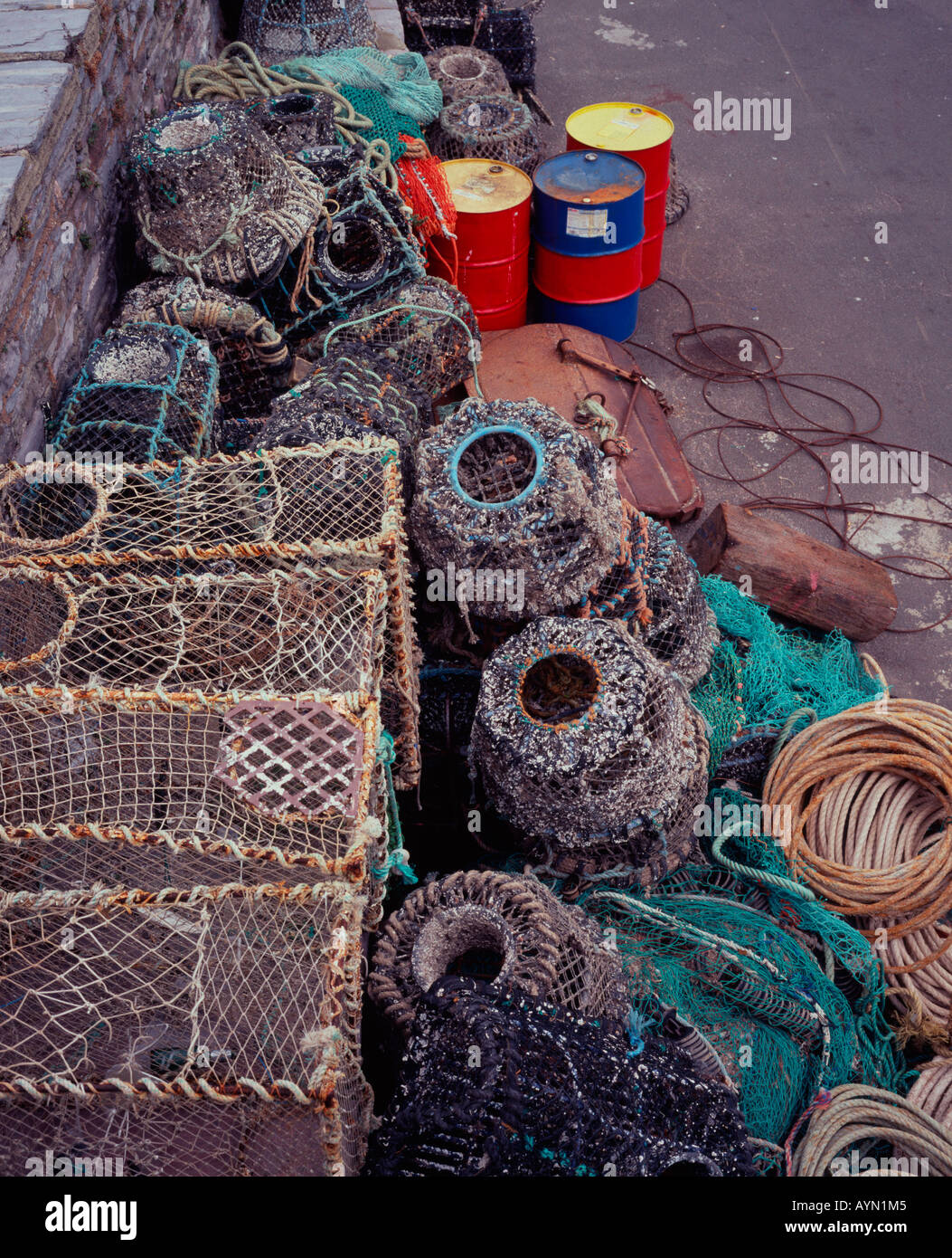 Lobster pots and fishing nets on the jetty, Brixham, Devon, UK Stock ...