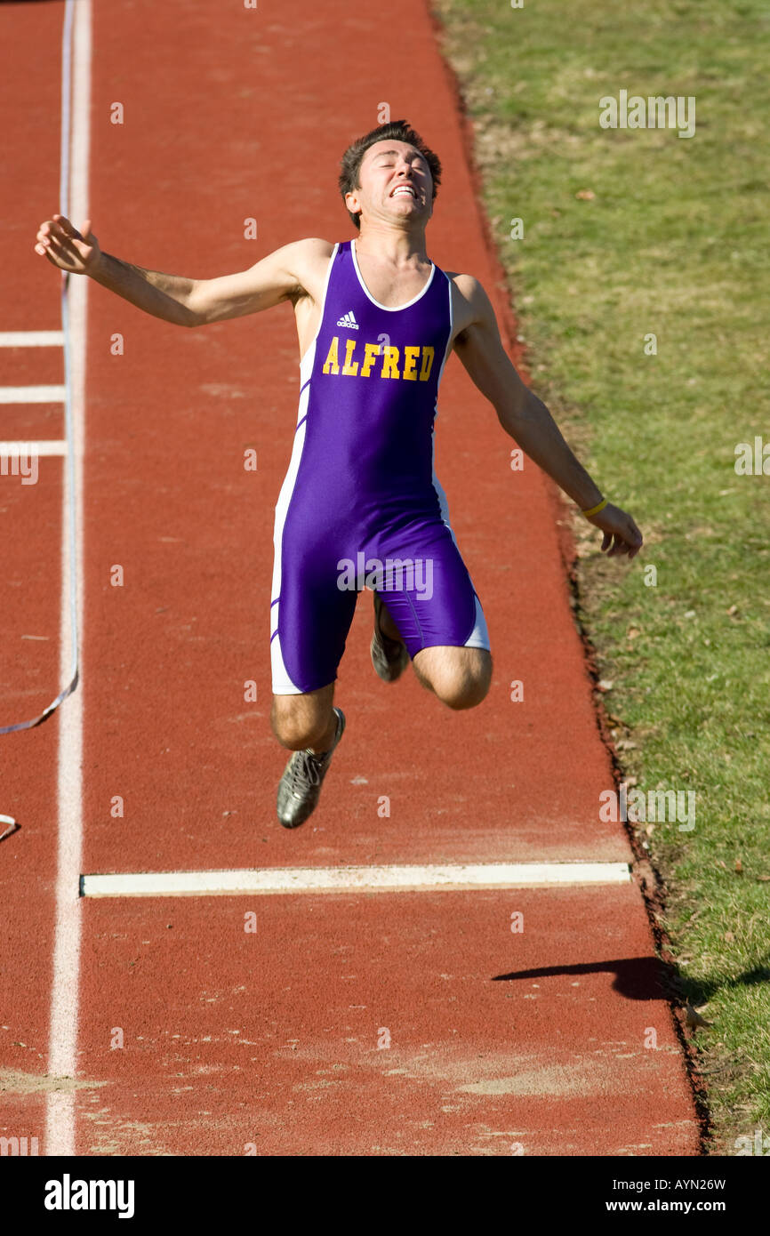 Athlete performs long jump Stock Photo - Alamy