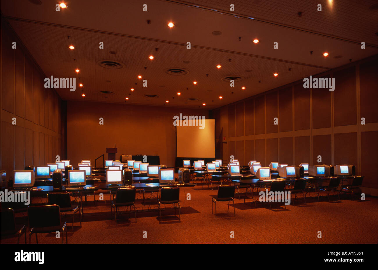 Empty computer classroom with 40 old apple monitors in conference ...