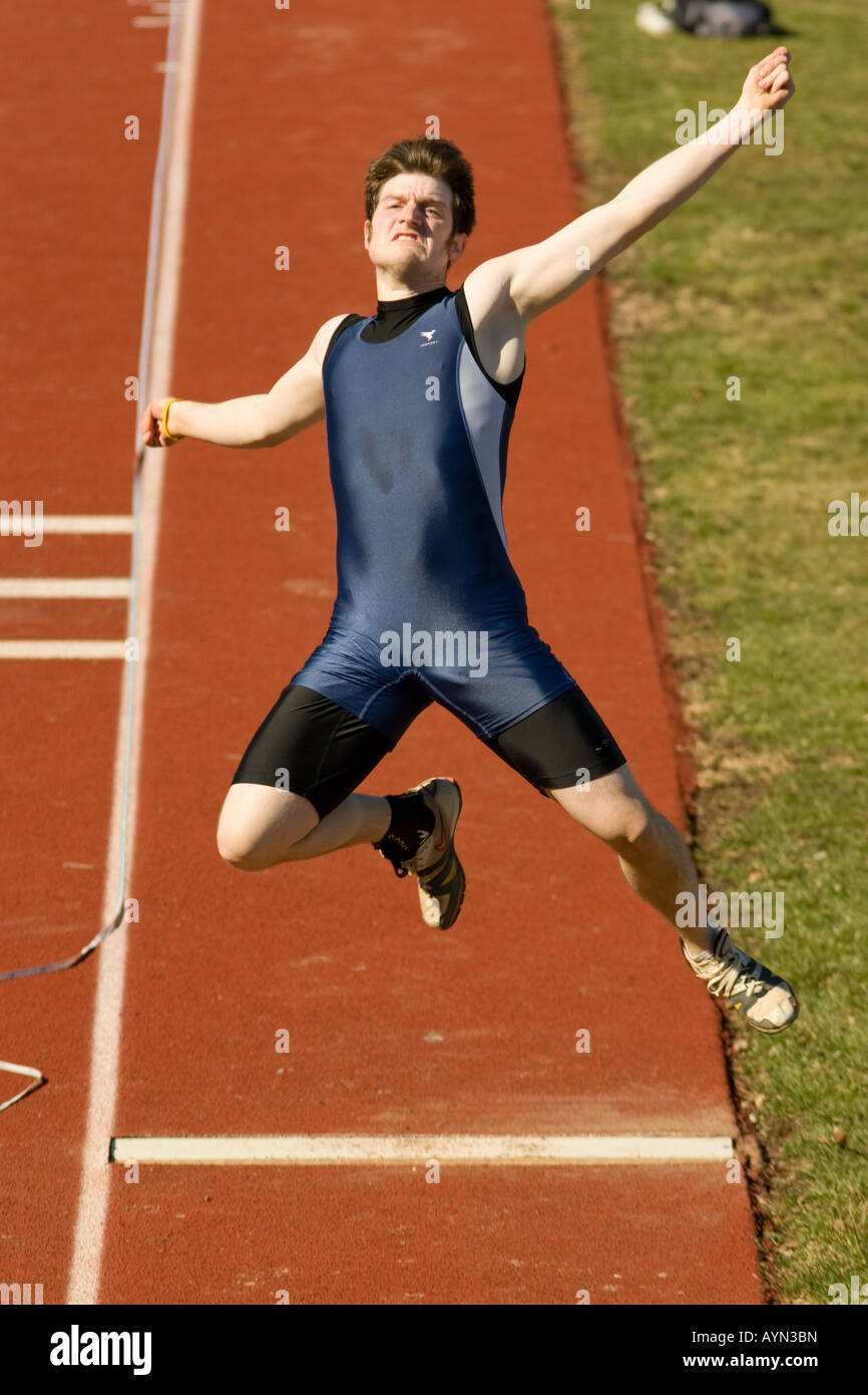 Athlete performs long jump Stock Photo - Alamy