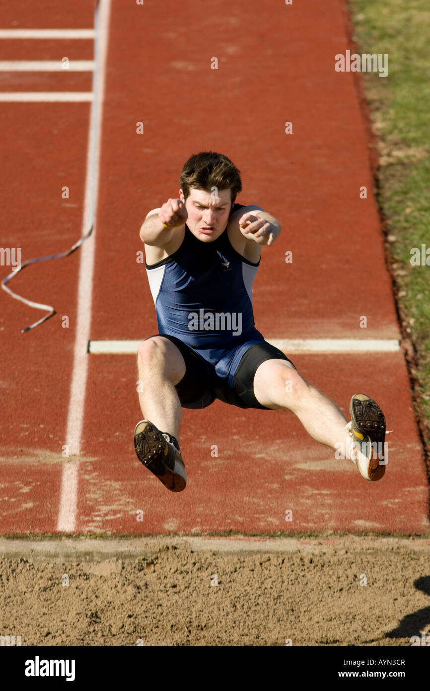 Athlete performs long jump Stock Photo - Alamy