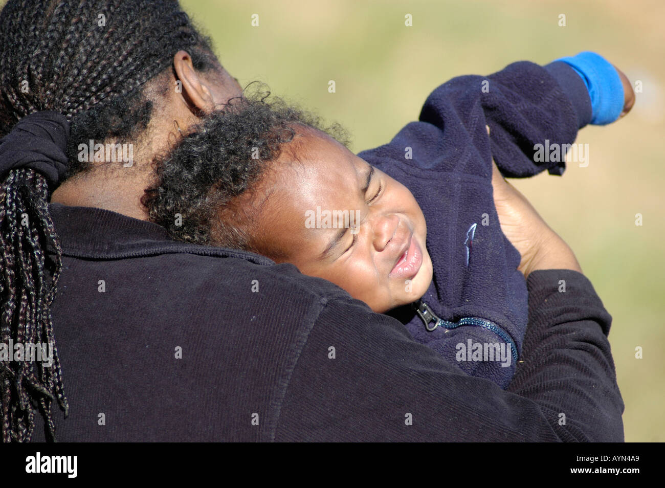 Mother and her young toddler son struggling Stock Photo - Alamy