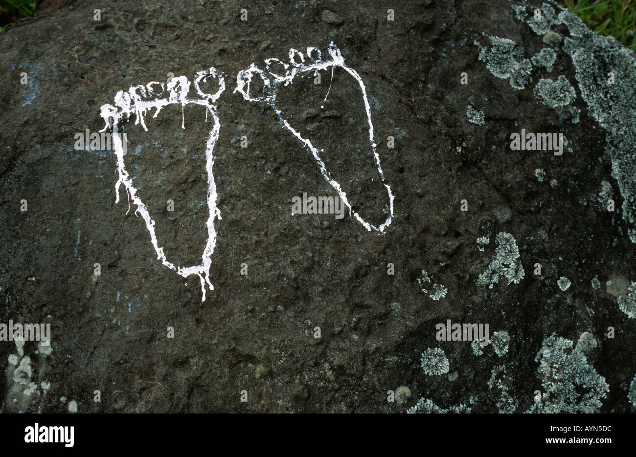 Sulawesi Tana Toraja. Painted footprints on a rock. Simple Buddhist ...
