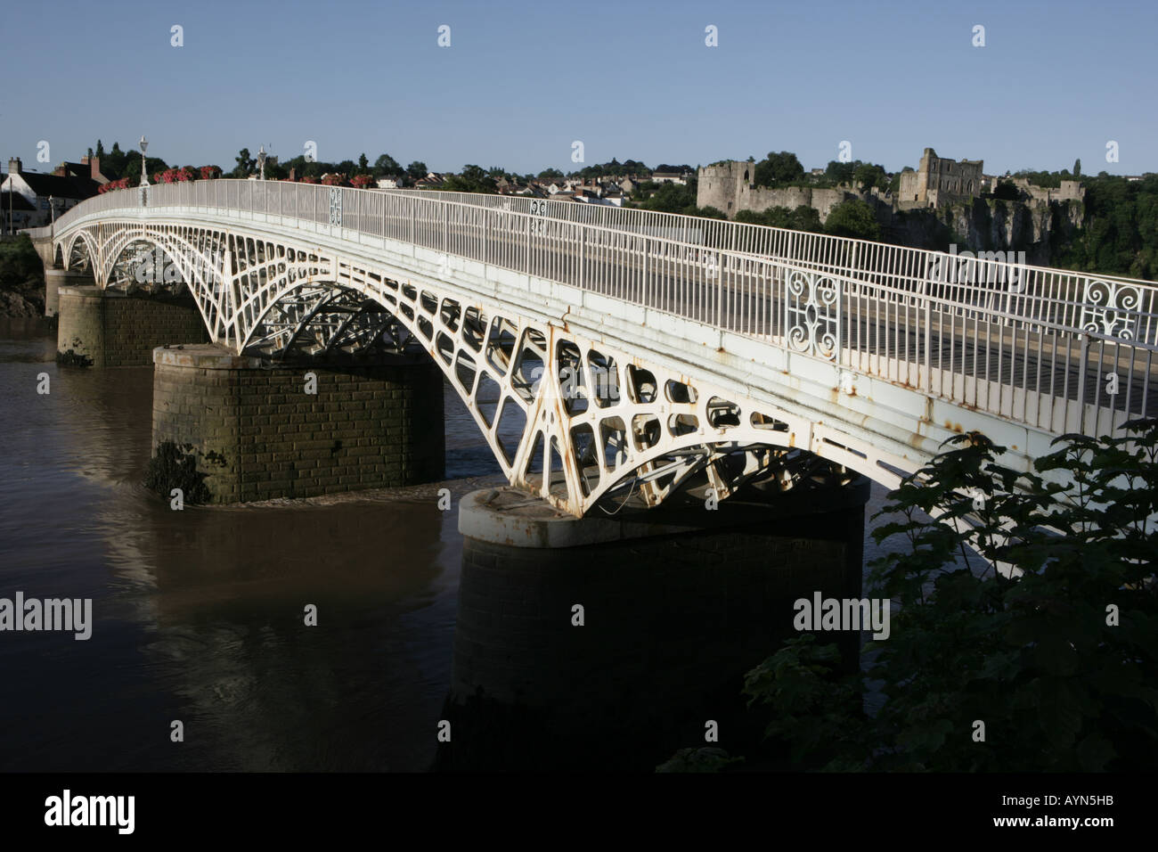 The bridge over the river Wye at Chepstow with its norman castle Stock ...