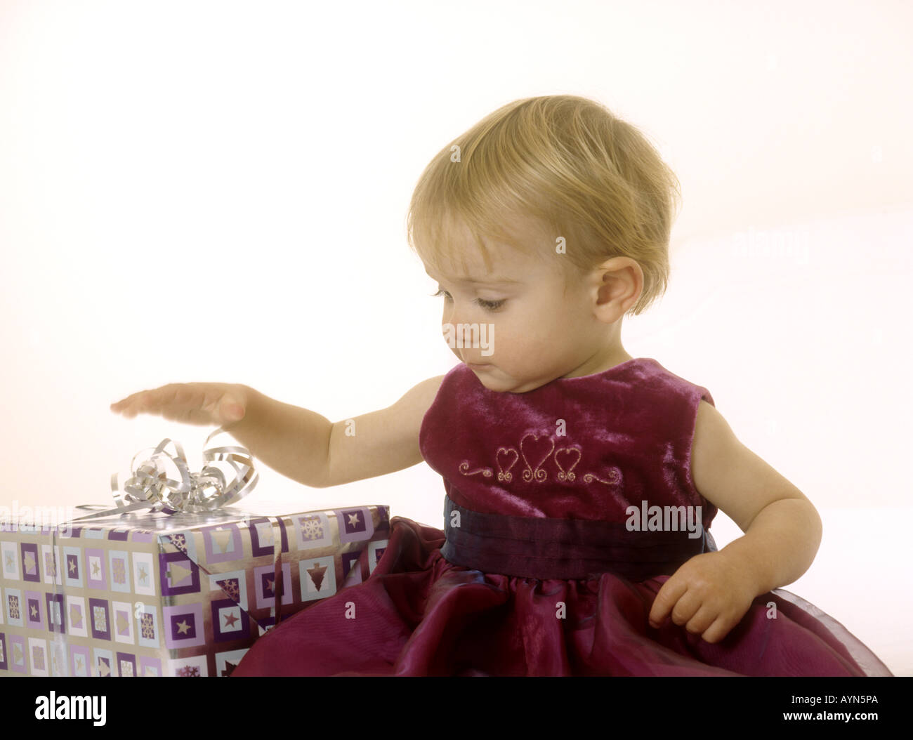 Year old girl opening presents hi-res stock photography and images - Alamy