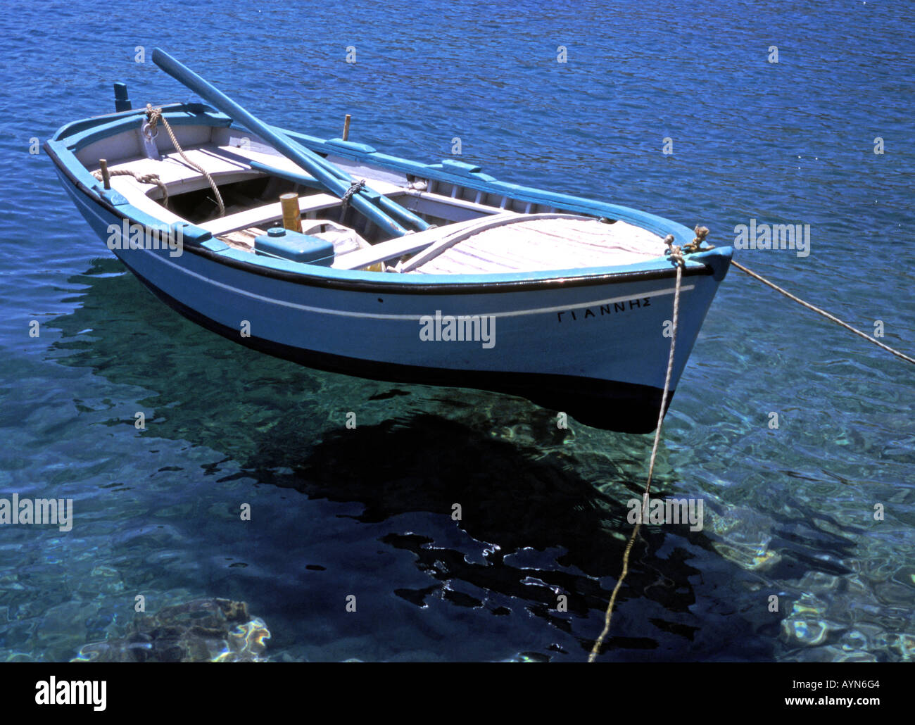 Rowing boat on the blue sea Stock Photo - Alamy