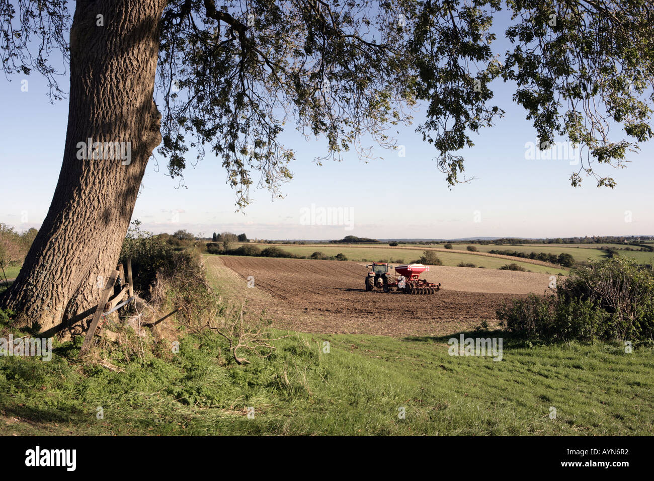 A farmer at work in the Cotswold countryside near Minster Lovell on a ...
