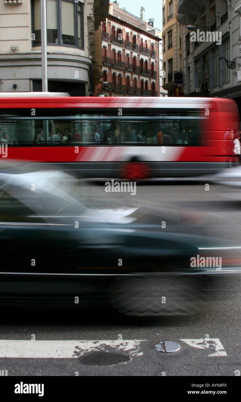 Motion blurred cars driving through city Stock Photo - Alamy