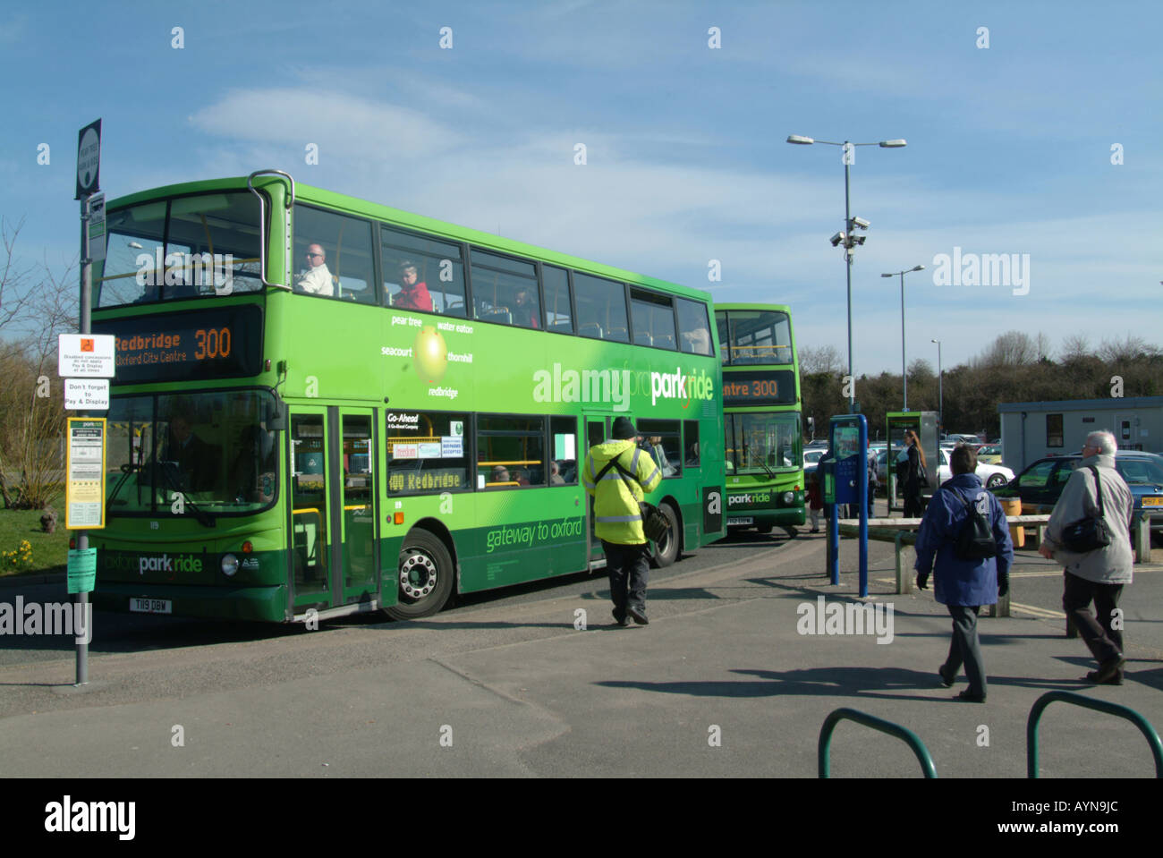 Double-decker bus picking up passengers at Oxford's Pear Tree Park and ...