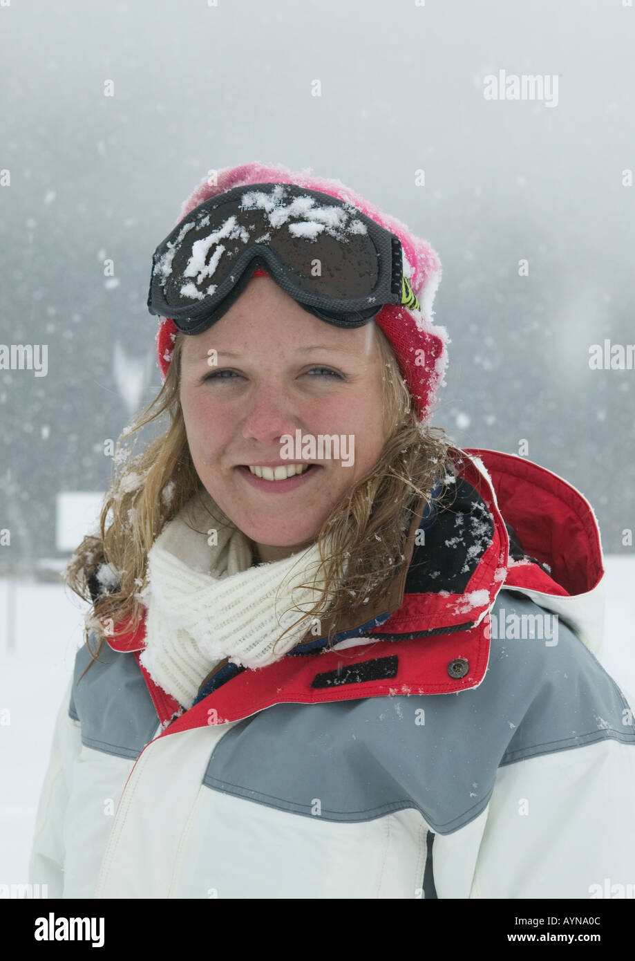 portrait of girl in snow wearing skigoggles on head Stock Photo - Alamy