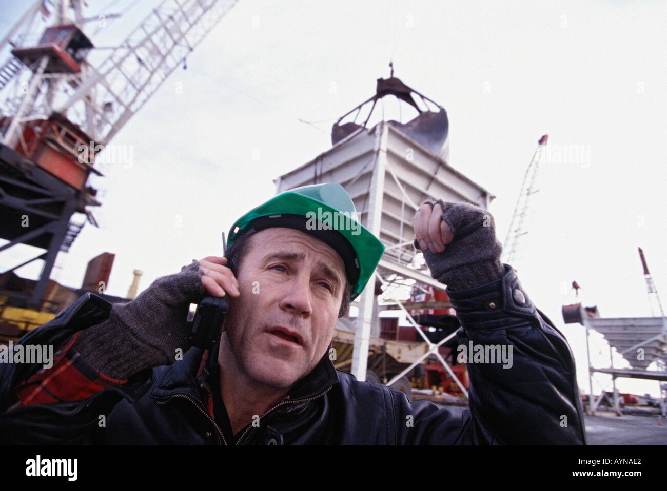 Longshoreman talking cargo ship dock hi-res stock photography and ...