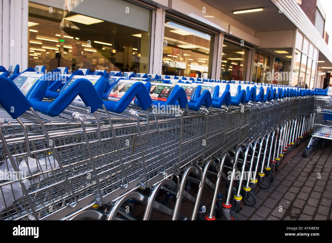 Stacked shopping carts outside supermarket Manchester UK Stock Photo ...