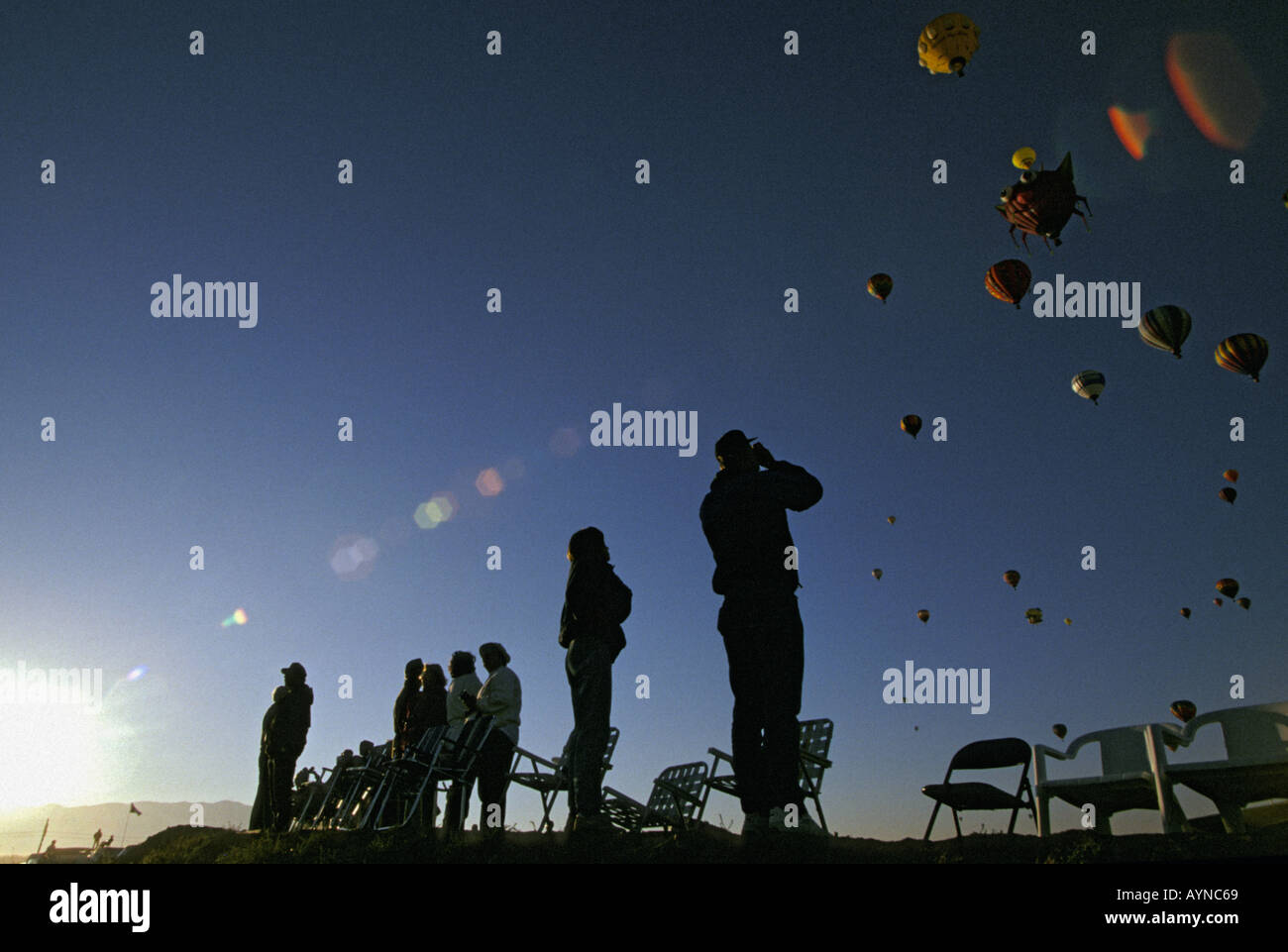 Early morning spectators watching the mass ascent of balloons at the ...