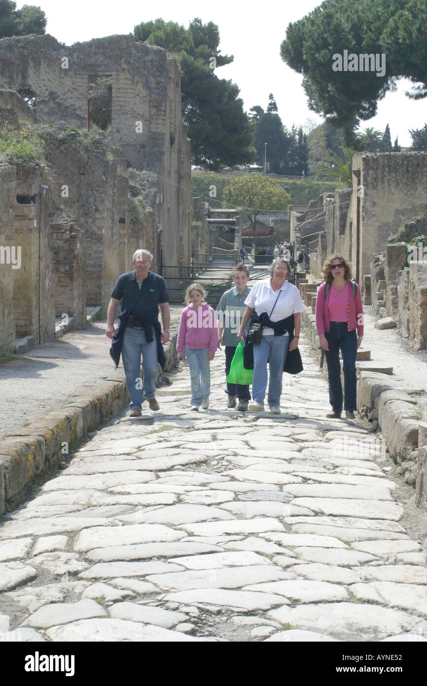 The ruins of Herculaneum Italy people walking in the street Stock Photo ...
