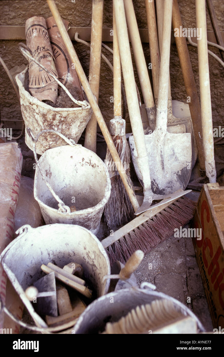 Still alive of the stone masons tools. Buckets, broom, shovels, and ...