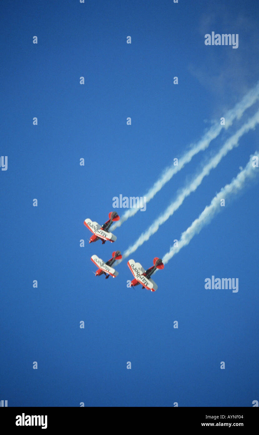 bi planes flying in formation with smoke trail Stock Photo - Alamy