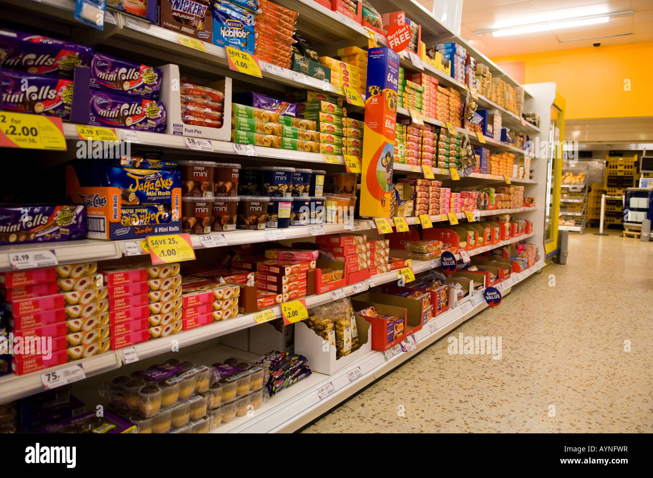 Sweets stacked on supermarket shelves Manchester UK Stock Photo - Alamy
