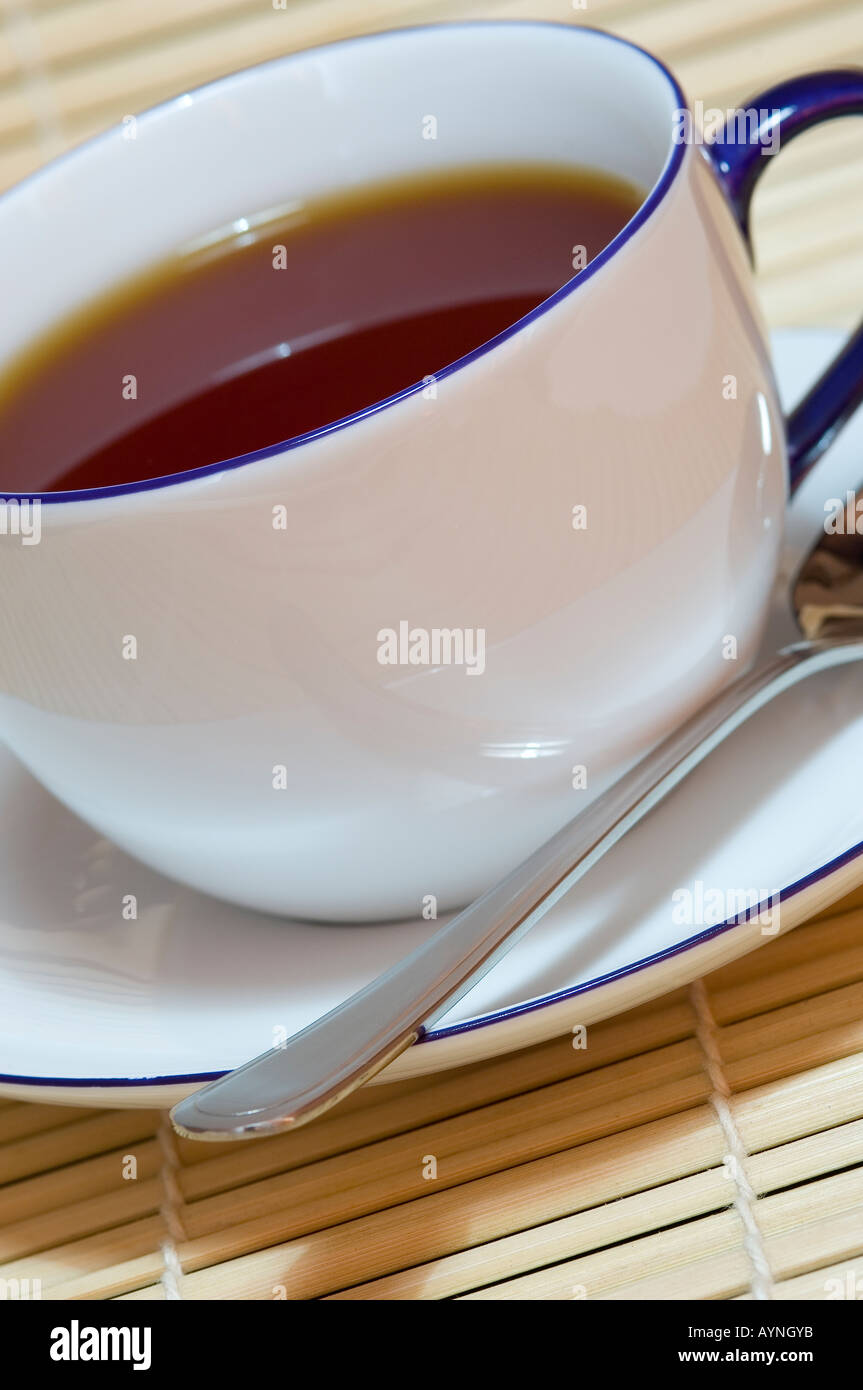 Close up of Freshly Poured Tea without milk in a white cup and saucer ...