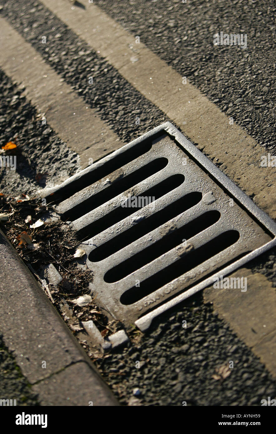 A roadside drain with double yellow lines Stock Photo - Alamy