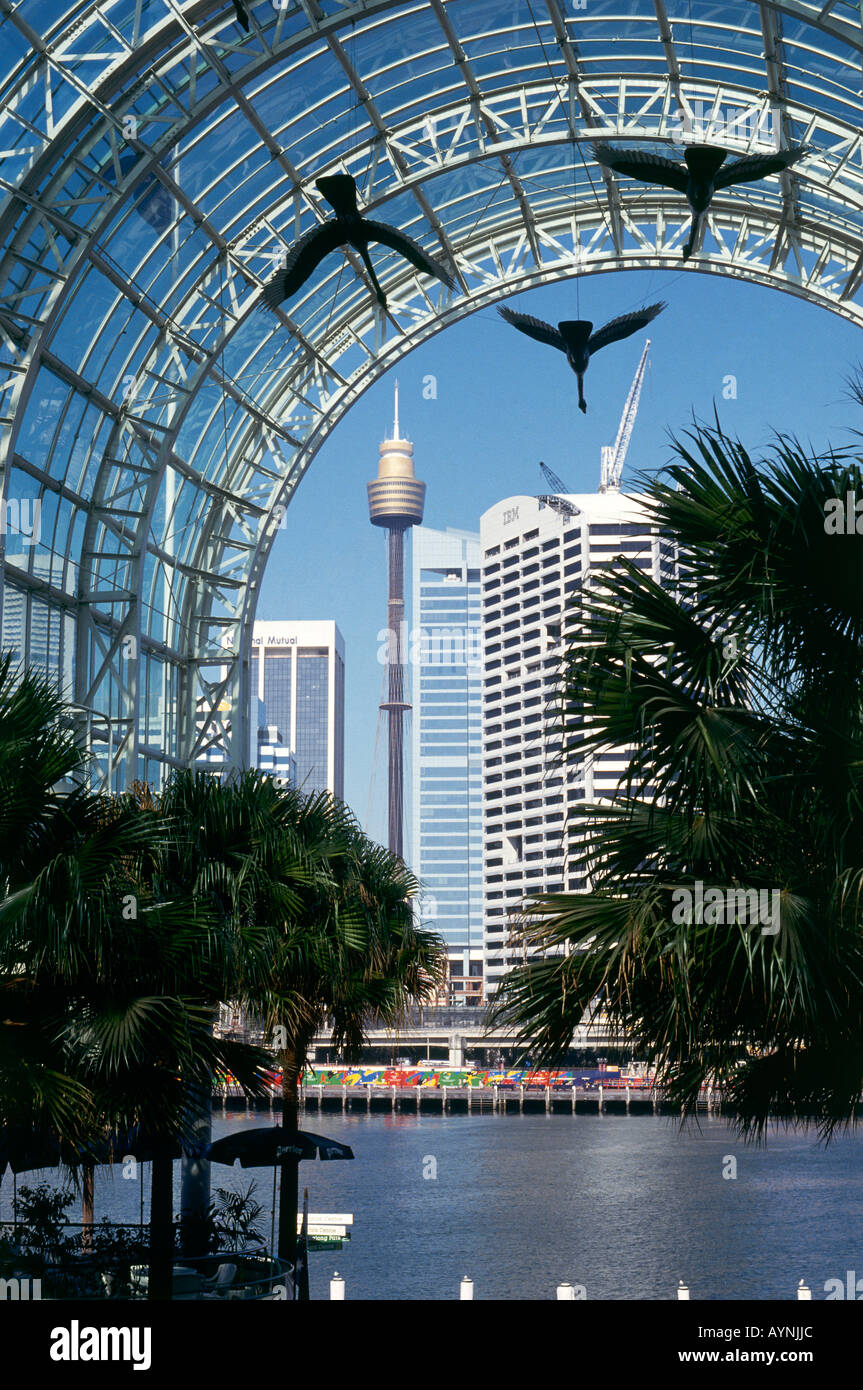Birds flying through a huge metal arch which is part of the waterfront ...
