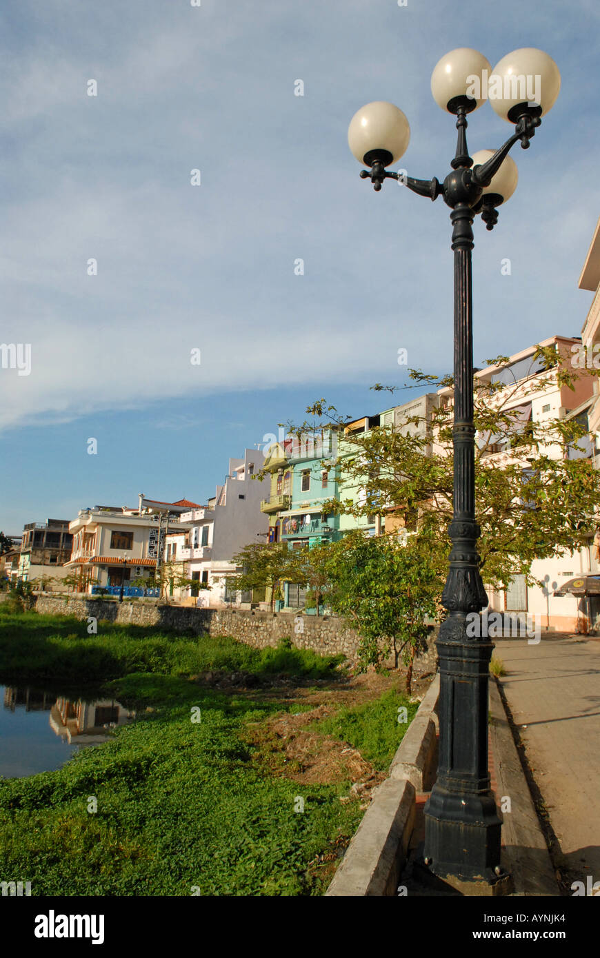 Street and sidewalk next to the moat separating the city citadel of Hue ...
