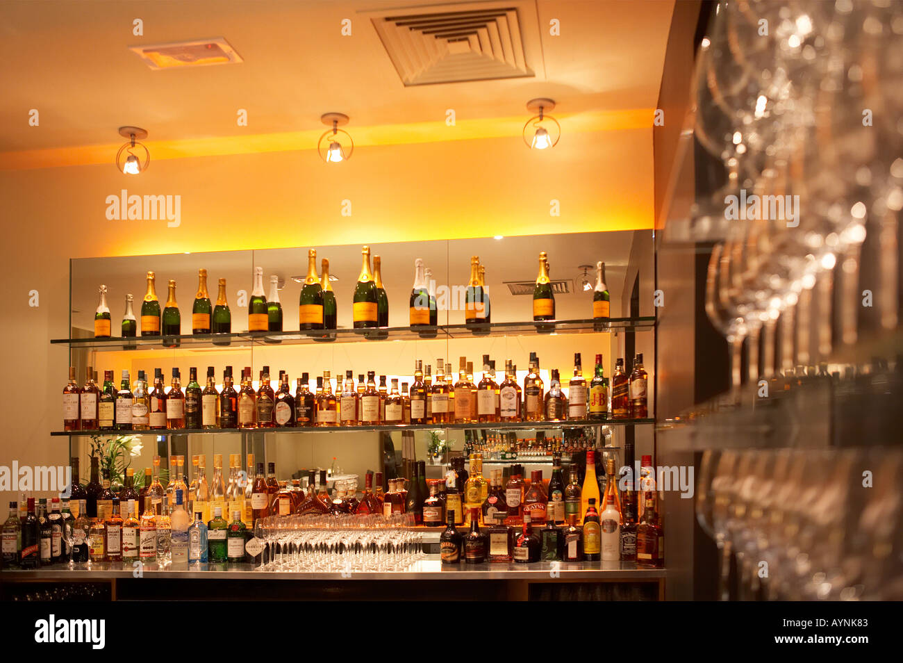 BOTTLES AND GLASSES ON HOTEL BAR Stock Photo - Alamy