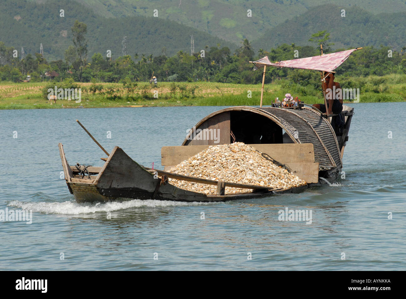 Sand dredging small motor boat on the Perfume river in central vietnam ...