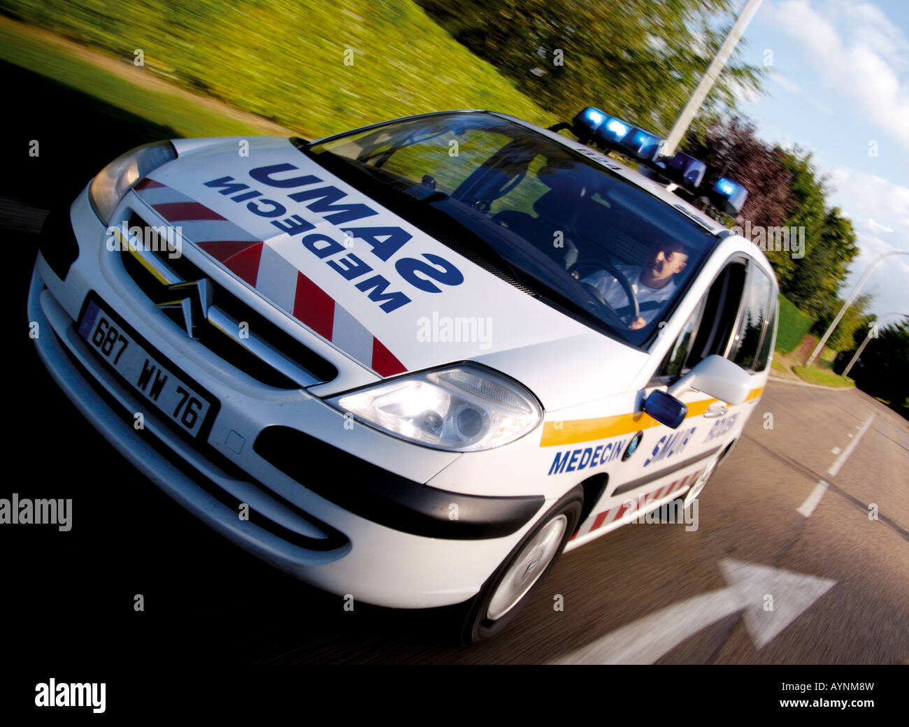 Doctor's emergency medical vehicle of SAMU speeding on the street ...