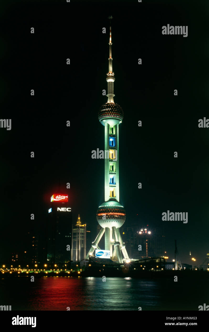 Illuminated at night the NEC building and the Oriental Pearl television ...