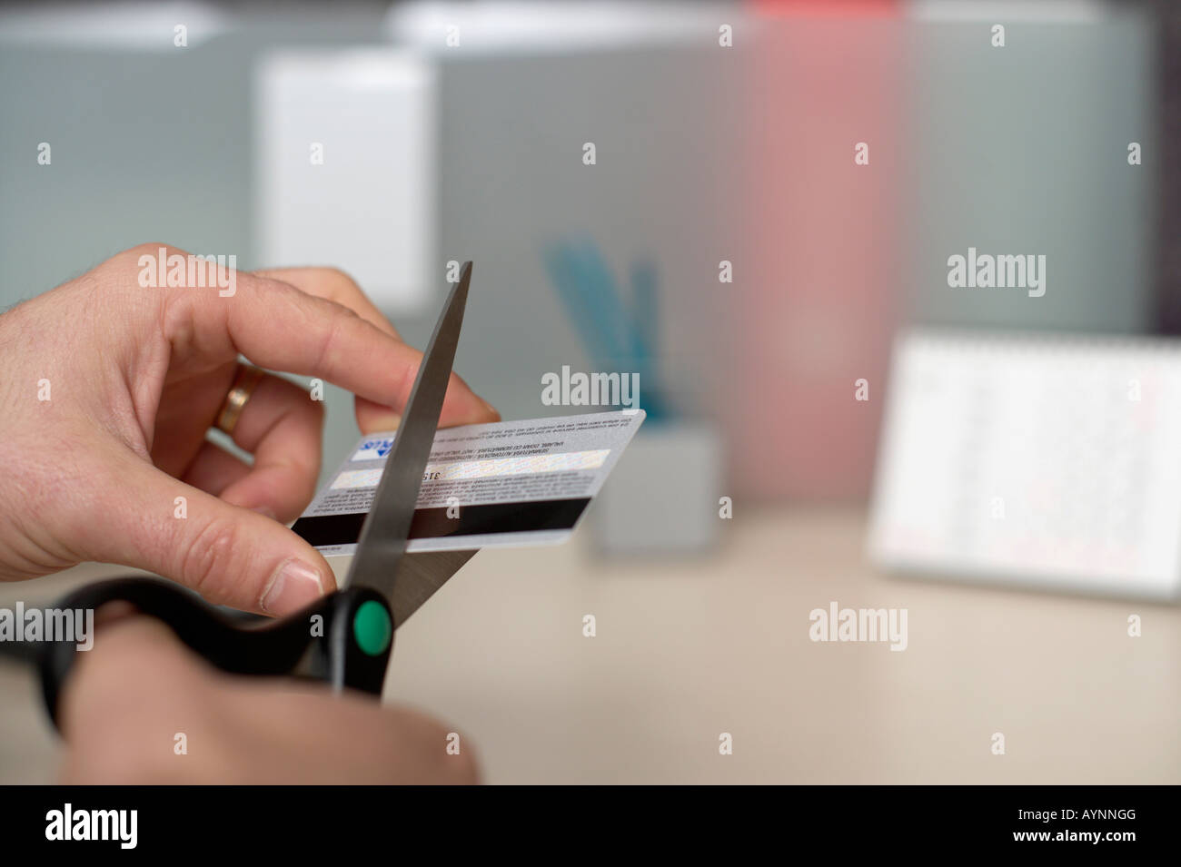 Businessman cutting his credit card in two Stock Photo - Alamy