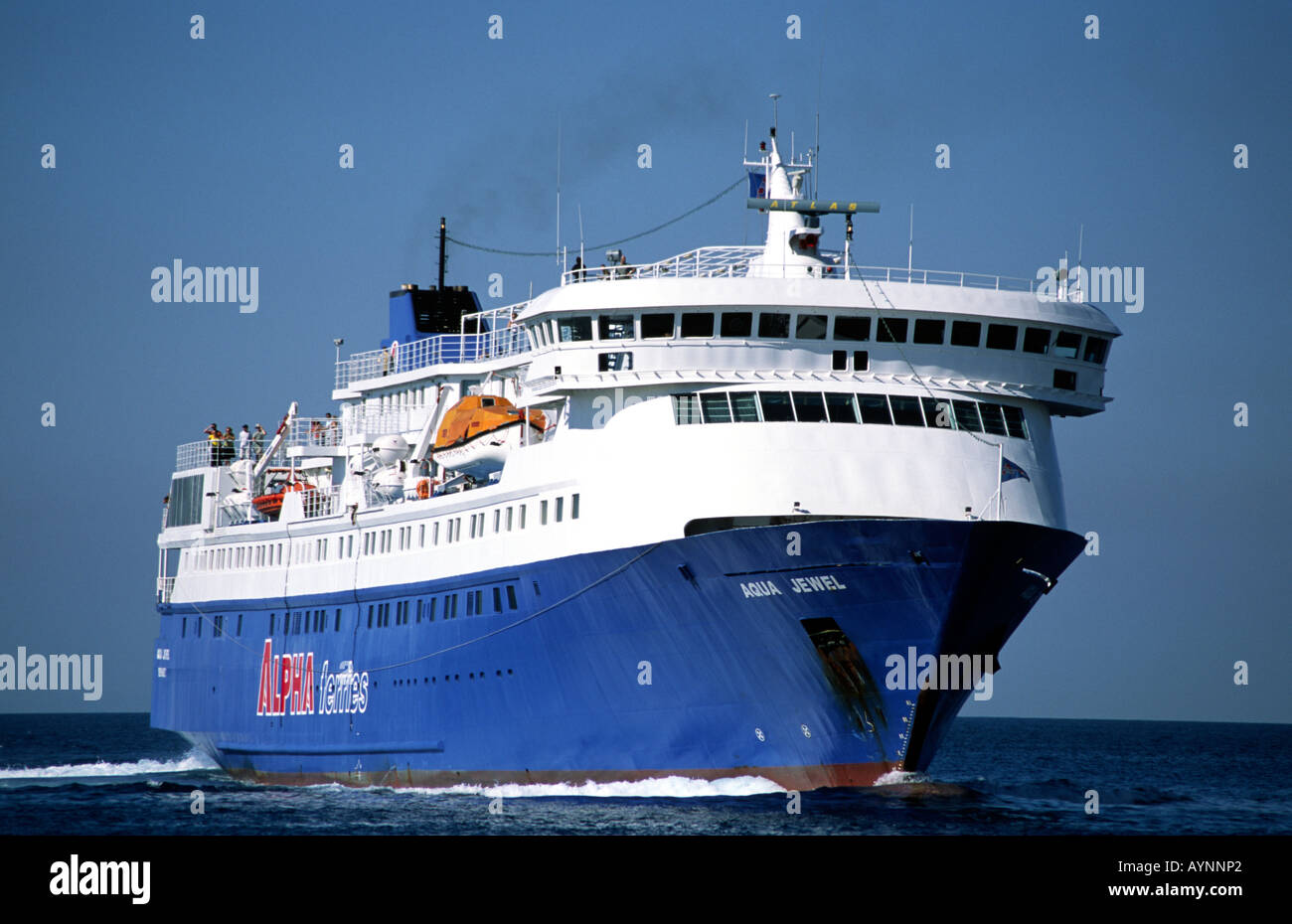 The ferry Aqua Jewel arrives at Tinos in the greek Aegean Islands Stock ...
