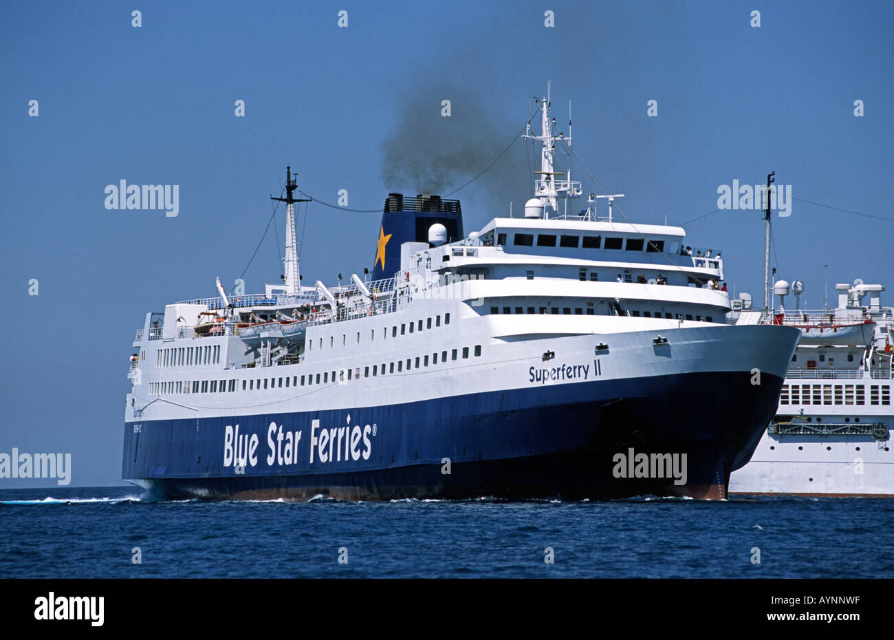 The Superferry 2 of Blue Star Ferries arrives at Tinos in the Greek ...