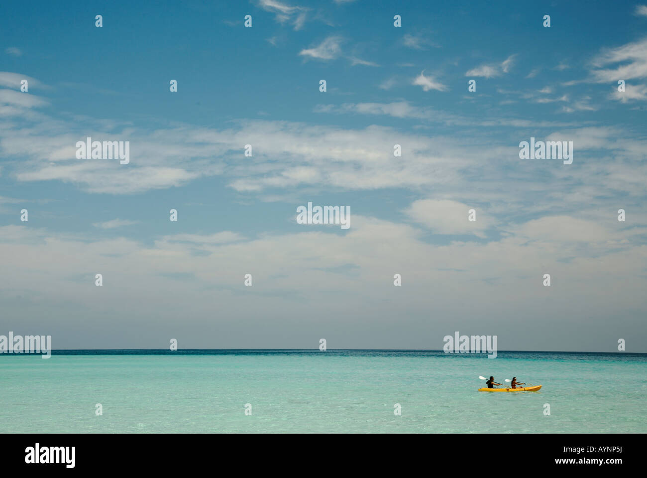 man and woman going with canoe at Maldives, Kuramathi island Stock ...