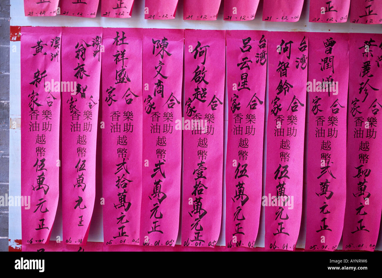 Votive papers hang on a wall at Tien Hau Pagoda Cholon Ho Chi Minh City ...