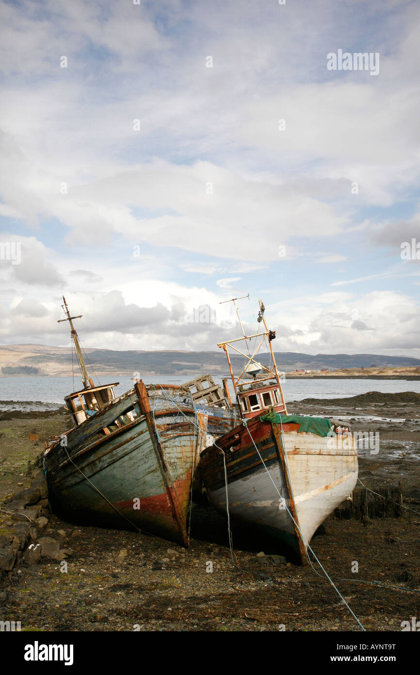 Two beached, Wrecked & Abandoned old wooden fishing boats on the beach ...