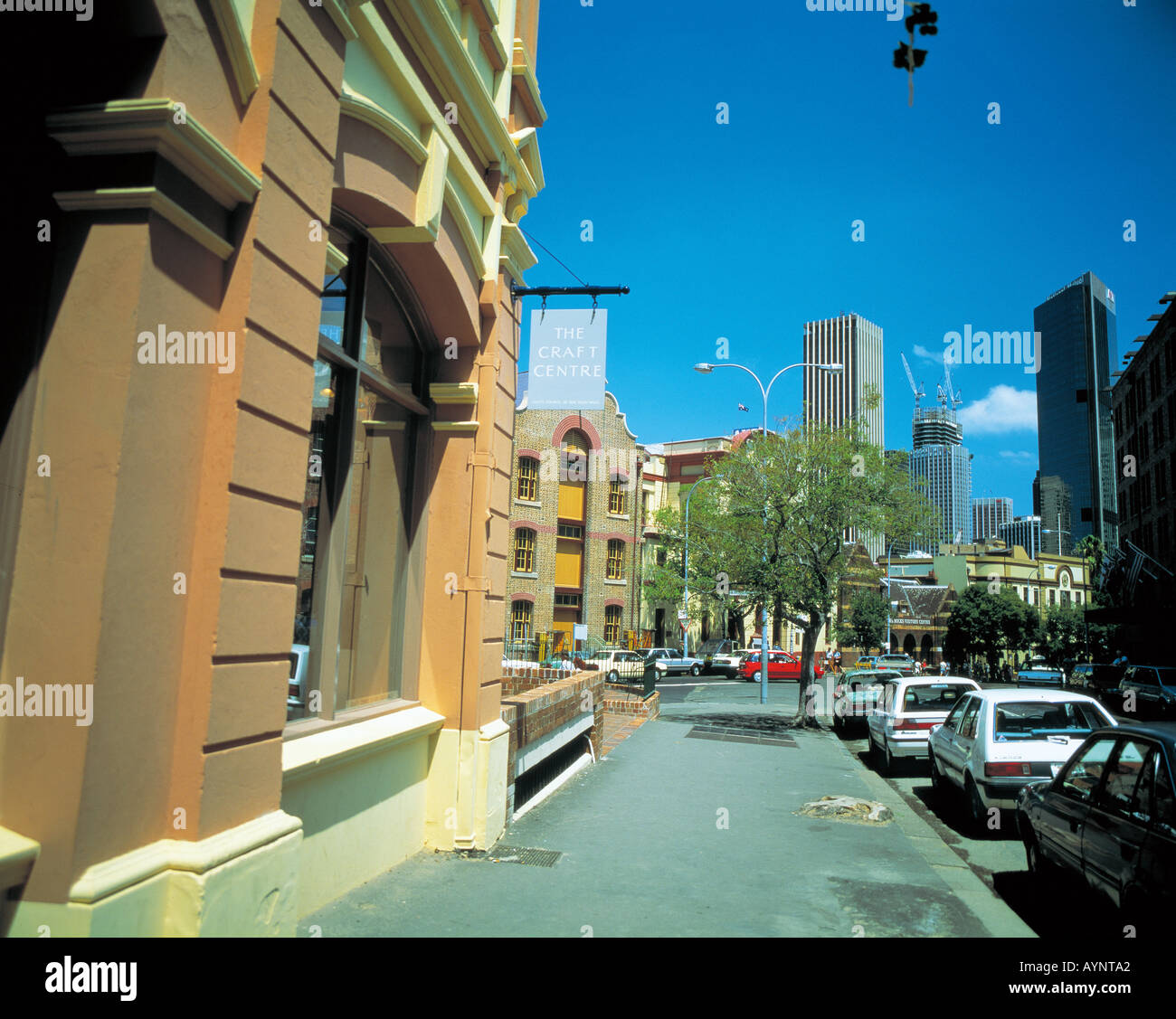 Building with Parked Cars Stock Photo - Alamy
