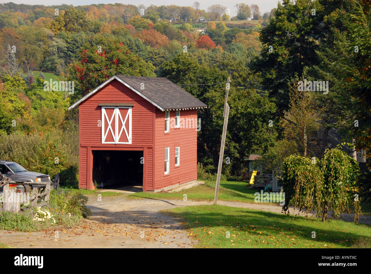 Small New England barn surrounded by autumn fall foliage Stock Photo ...