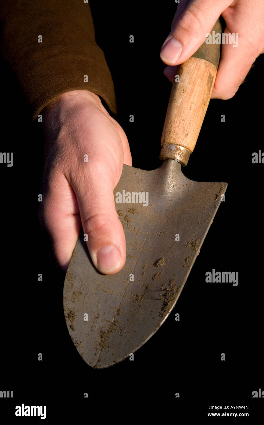 Man holding trowel hi-res stock photography and images - Alamy