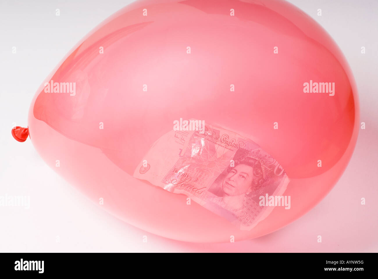 Stock photo of a twenty pound note inside a ballon Economic inflation ...